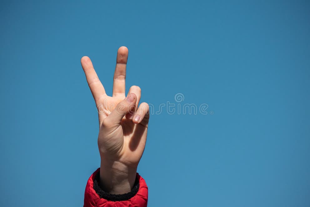 Child Making Peace Sign stock image. Image of child - 243096007