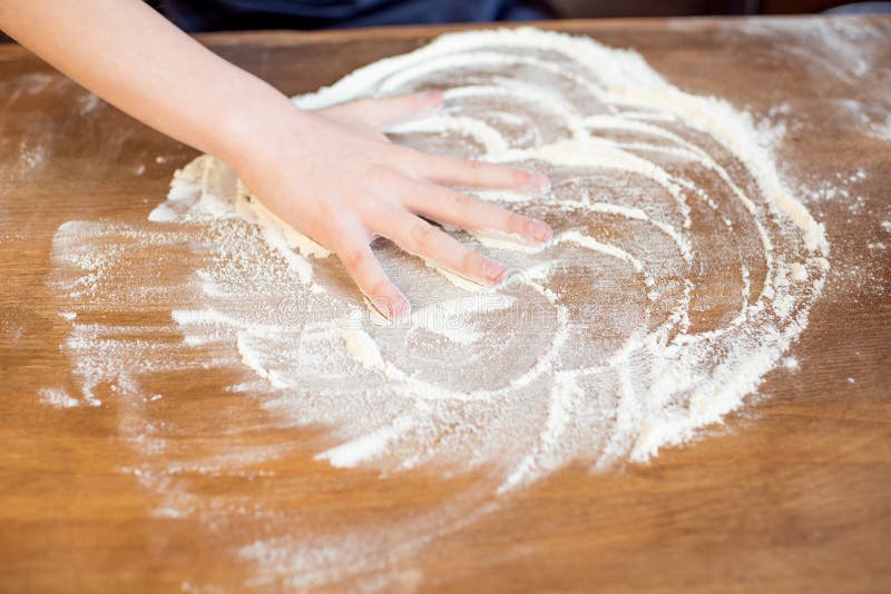 Child Making Pizza Dough on Wooden Tabletop in Kitchen Stock Photo ...