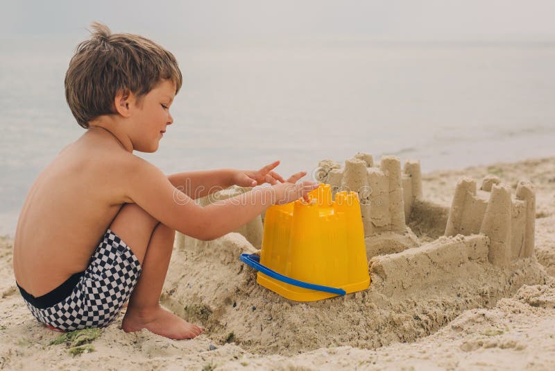 207 Boy Playing Beach Making Sand Castle Stock Photos - Free & Royalty ...
