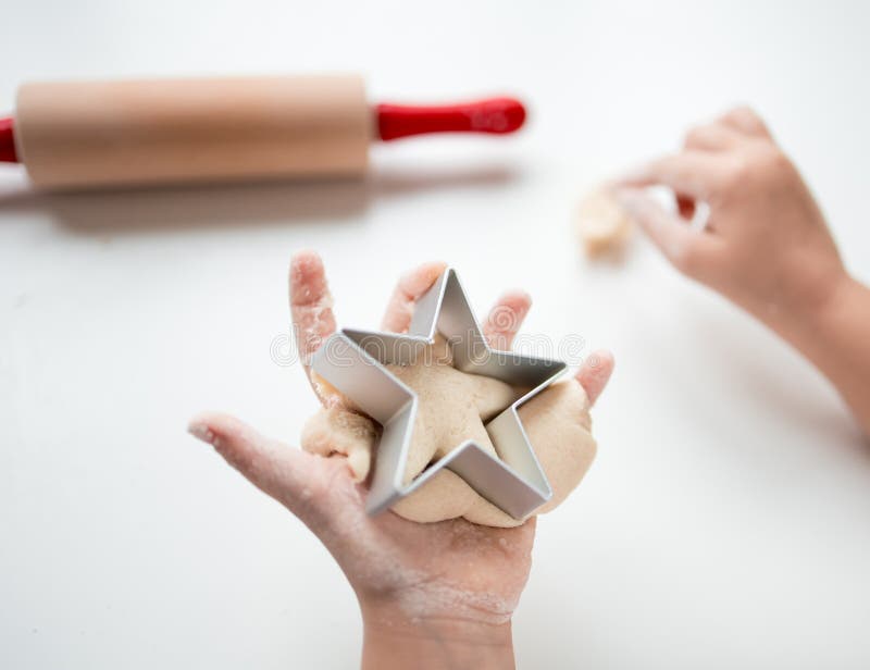 Child Making Star Shaped Cookies with Dough and Cutter in Kitchen Stock ...