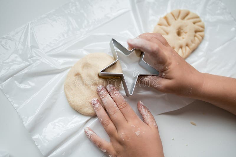 Child Making Star Shaped Cookies Using Dough and Cookie Cutter on ...