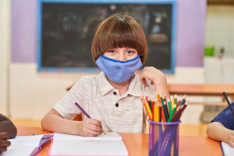 Child with Mask because of Covid-19 while Studying Stock Image - Image ...