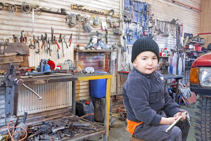 Child Mechanic Working in Workshop Stock Image - Image of wrenches ...