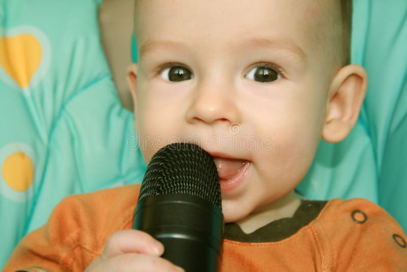 The Child with a Microphone Stock Image - Image of months, person: 1810255