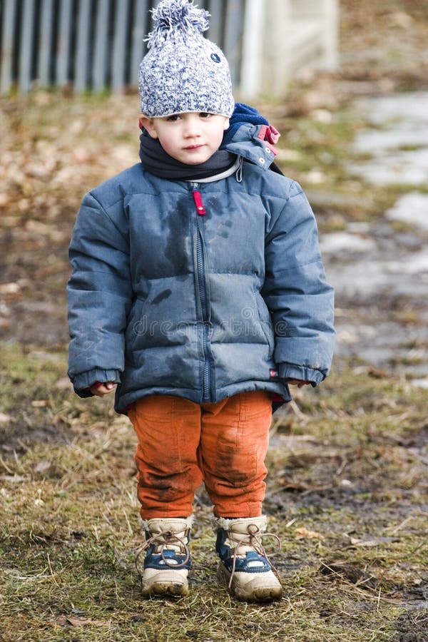 Child with muddy clothes stock photo. Image of stained - 5105836