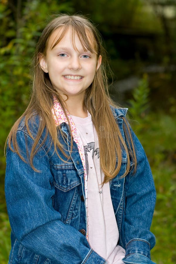 Tween Girl leaning on Tree stock image. Image of outdoors - 10979011