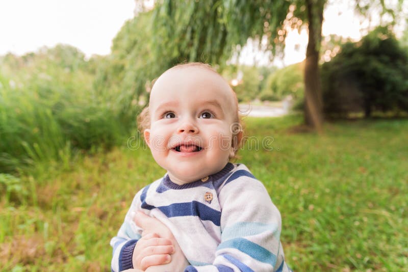 A Child in Nature. Cheerful Boy in Nature Stock Photo - Image of ...