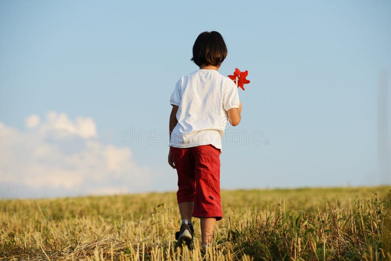 Child in nature stock image. Image of joyful, grass - 218857957