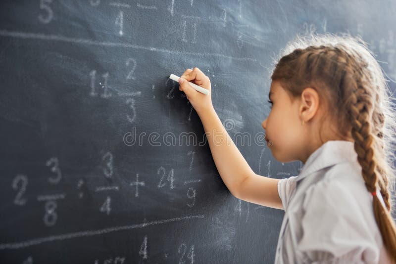 Child near the blackboard stock image. Image of diligence - 95615765