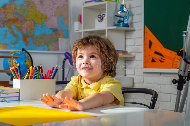 Child Near Chalkboard in School Classroom. Educational Process. Kids ...
