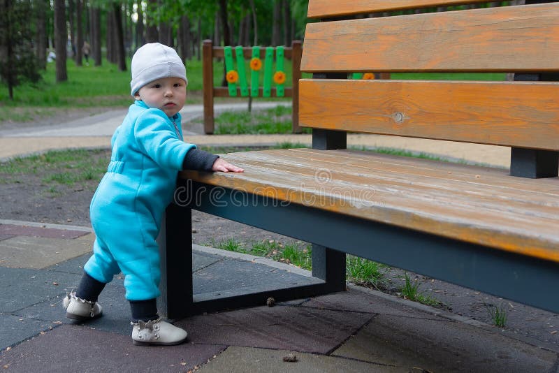 The Child Near a Park Bench in Cool Weather Stock Image - Image of ...
