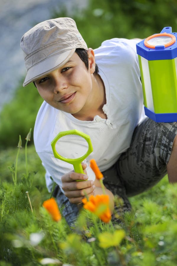 Child Observing Nature with a Magnifying Glass Stock Image - Image of ...