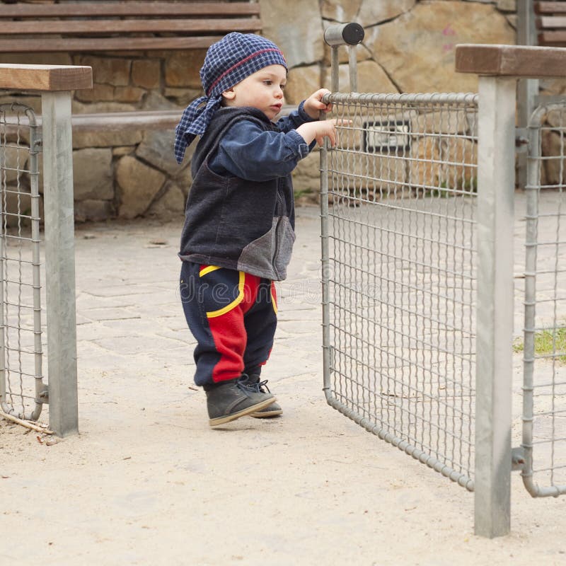 Child opening gate stock photo. Image of outdoor, outside - 23111804