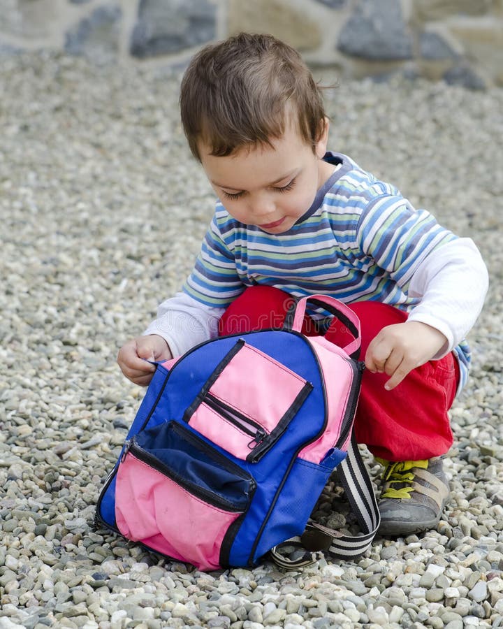 Child opening his bag stock image. Image of toddler, stones - 39320665