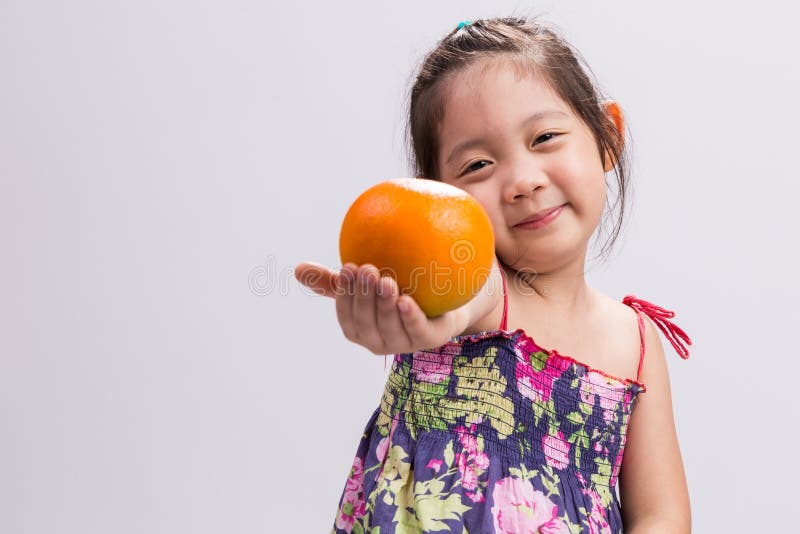 Child with Orange / Child with Orange Background Stock Photo - Image of ...