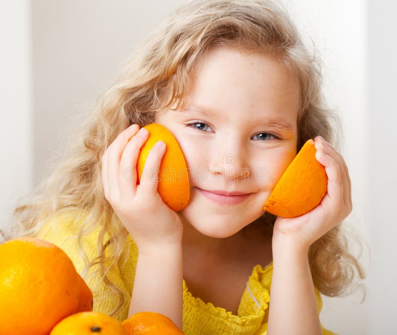 Child with oranges stock image. Image of orange, happiness - 22900577