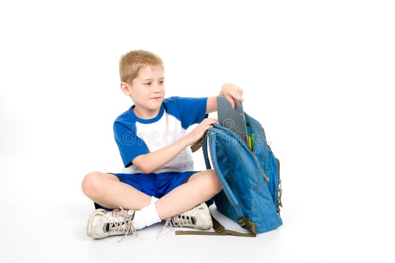 Child packing for school stock image. Image of background - 10527157
