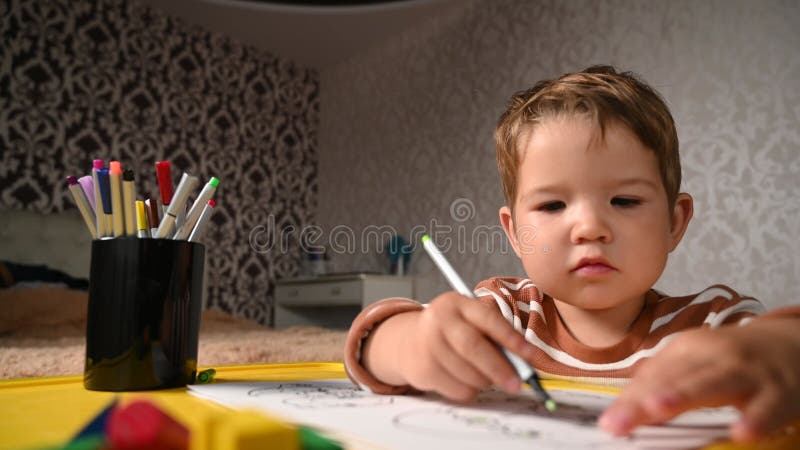 Child Paints a Coloring Book. Child Development To Creativity Stock ...