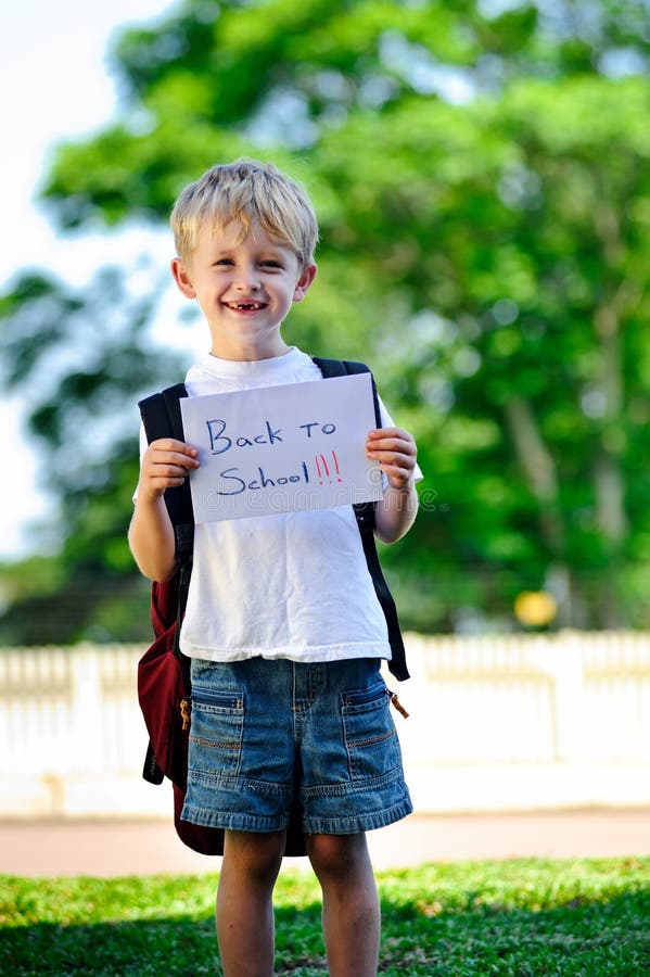 Child with paper sign stock photo. Image of young, back - 17218568