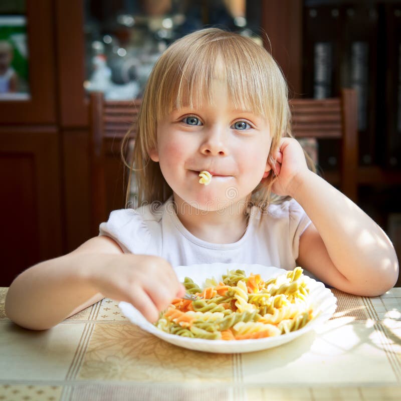 Child having spaghetti stock photo. Image of hungry, eating - 7023444