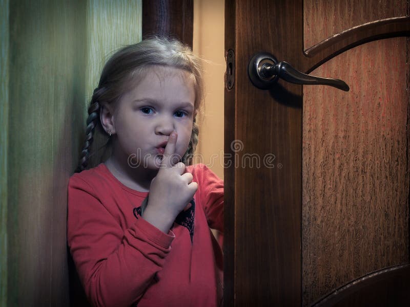 Child Peeps out and shows stock image. Image of blond - 202448743