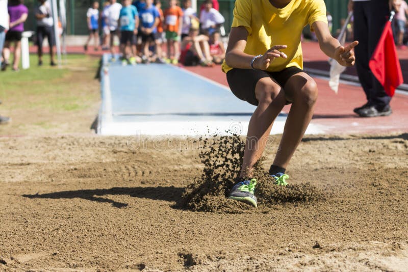 Child Performs the Long Jump Stock Image - Image of sweat, athlete ...