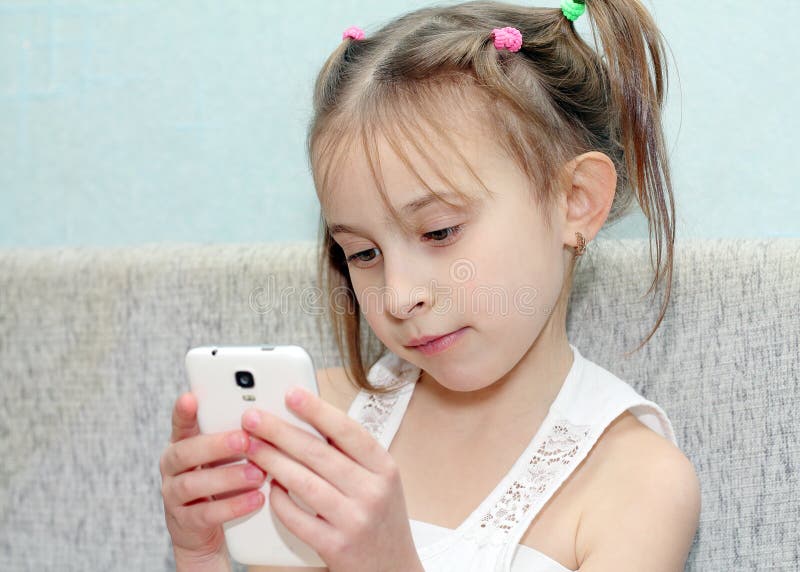 Child and phone stock image. Image of face, communications - 63194497