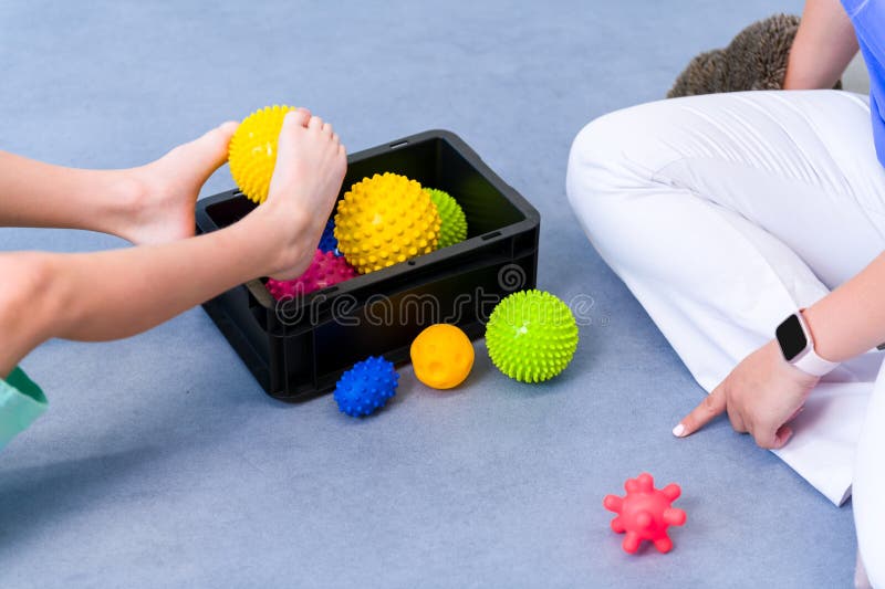 Child during Physical Therapy Session. Boy Exercising Barefoot with ...