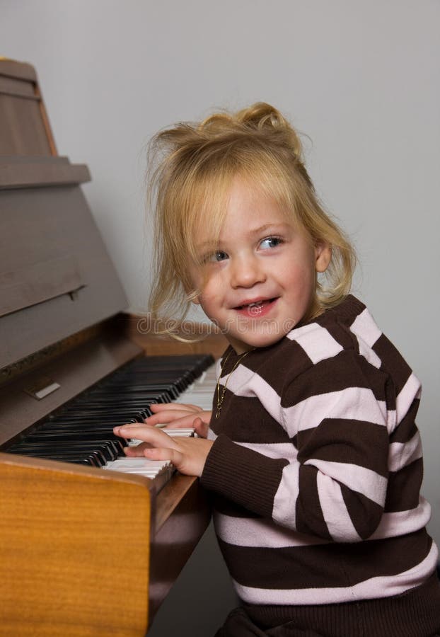 Child with piano stock image. Image of instruments, classical - 7392841