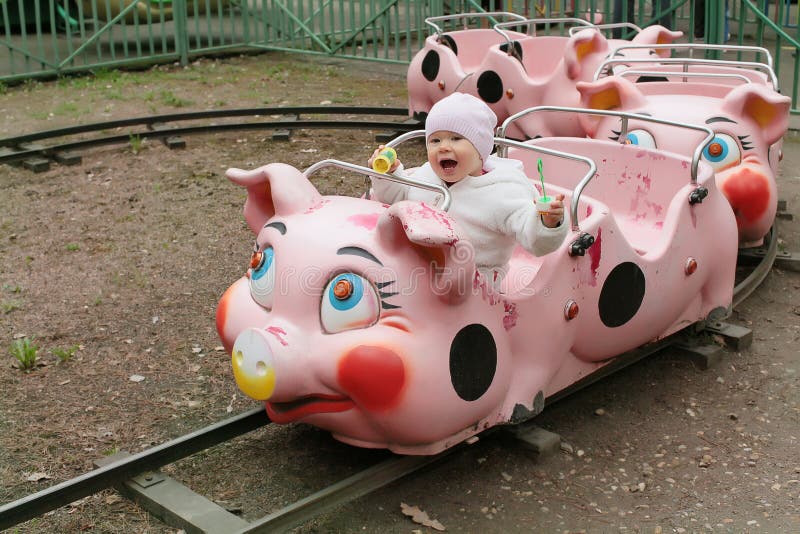 Child on Piggy Train in Entertainment Park Stock Photo - Image of train ...