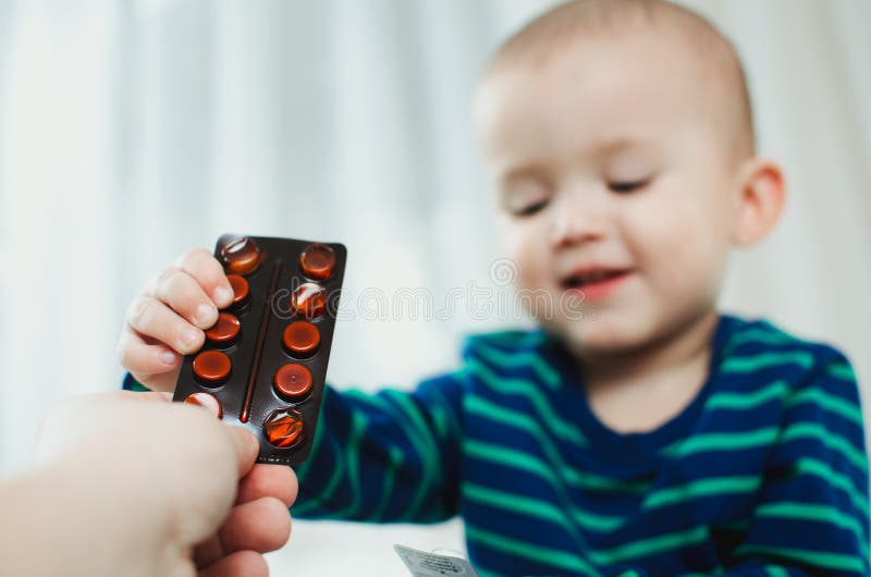 Child with pills stock photo. Image of fever, pill, addiction - 86699448