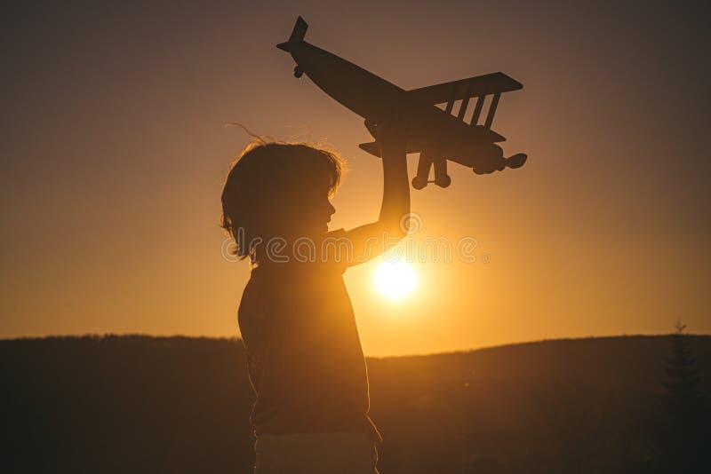 Child Pilot Aviator with Airplane Dreams of Traveling on Sunset. Stock ...
