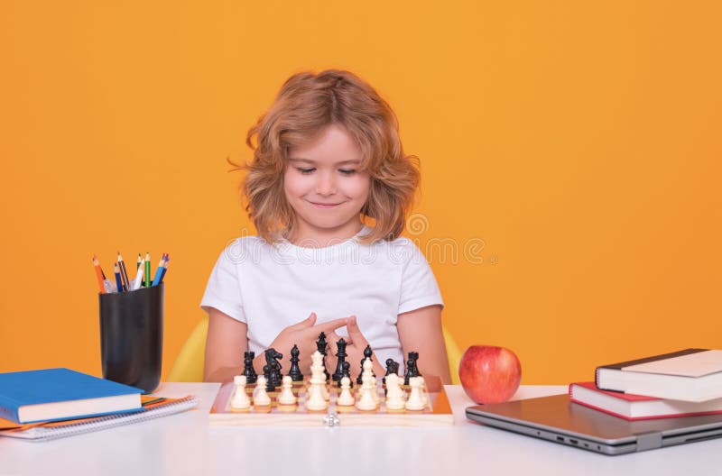 Child Play Chess on Studio Background. Kid Playing Chess. Clever Child ...