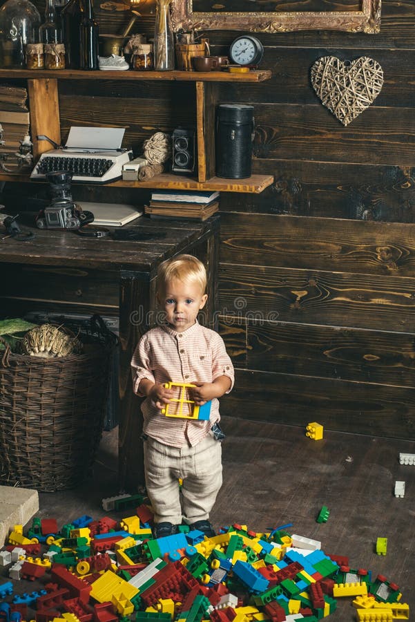 The Little Boy Who Build Towers with Plastic Cubes Stock Image - Image ...
