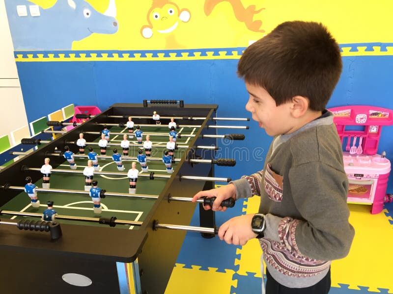 Child play foosball stock image. Image of child, foosball - 48564105