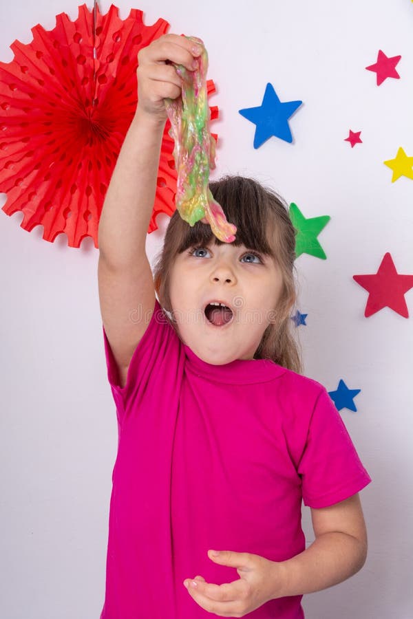 Child Play with Slime. Kid Squeeze and Stretching Slime. Stock Photo ...