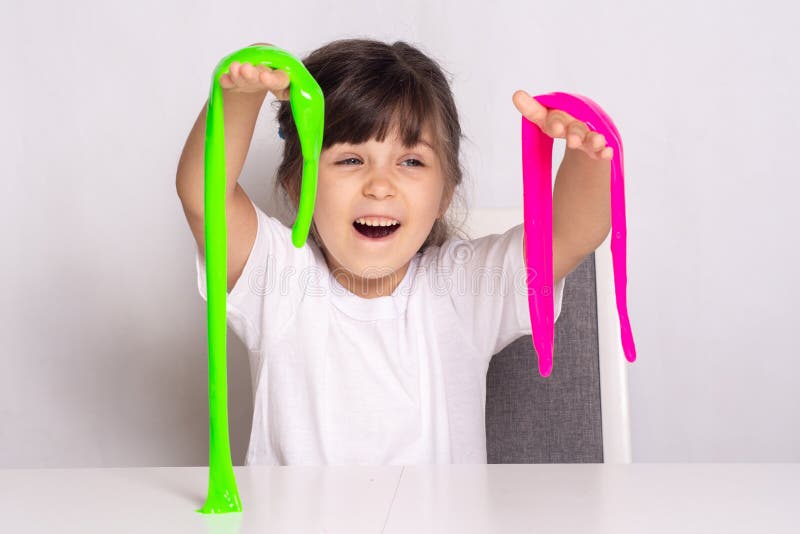 Child Play with Slime. Kid Squeeze and Stretching Slime. Stock Photo ...