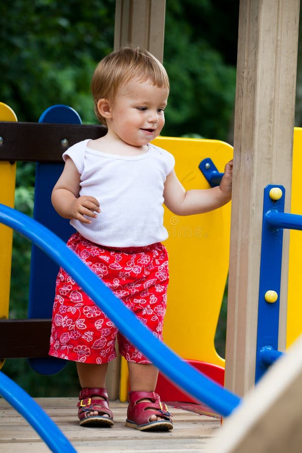 Child plays with pebbles stock photo. Image of play, interest - 18449966