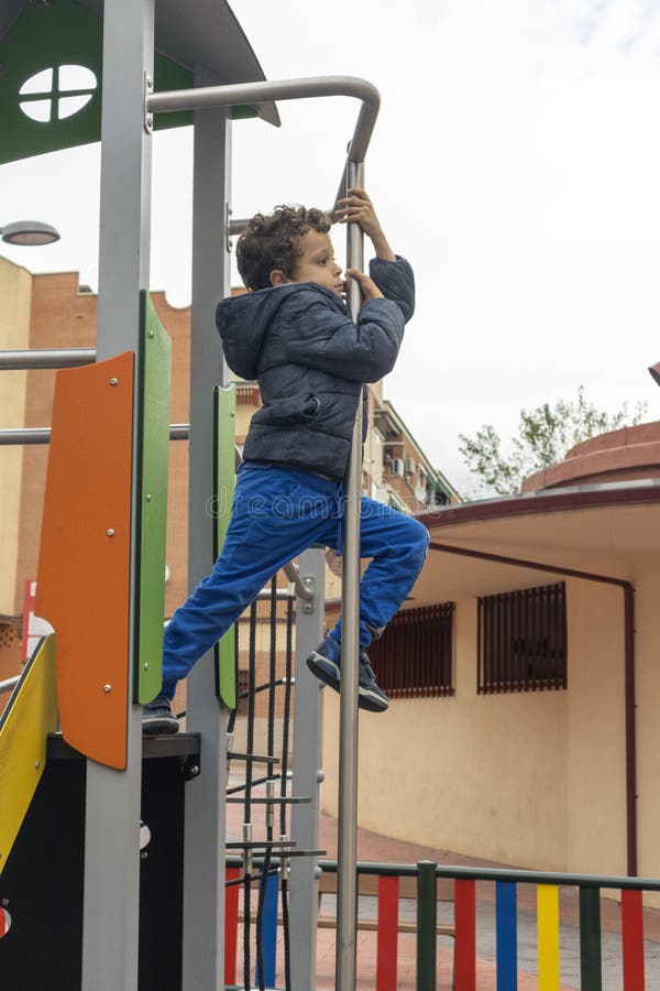 Child in Playground Sliding Down Fireman S Pole Stock Photo - Image of ...