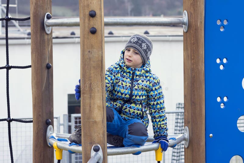Child at Playground in Winter Stock Photo - Image of outside, happy ...