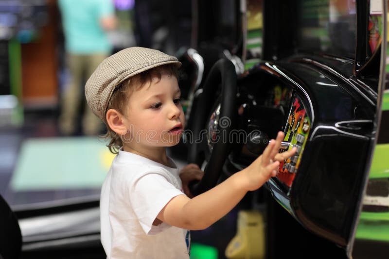 Boy Playing Arcade Simulator Machine Stock Photos - Free & Royalty-Free ...
