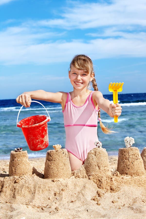 Child playing on beach. stock image. Image of sculpture - 18216307