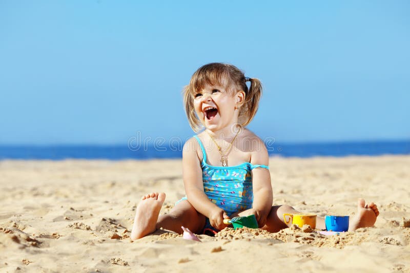 Child playing at the beach stock photo. Image of lifestyle - 20267756