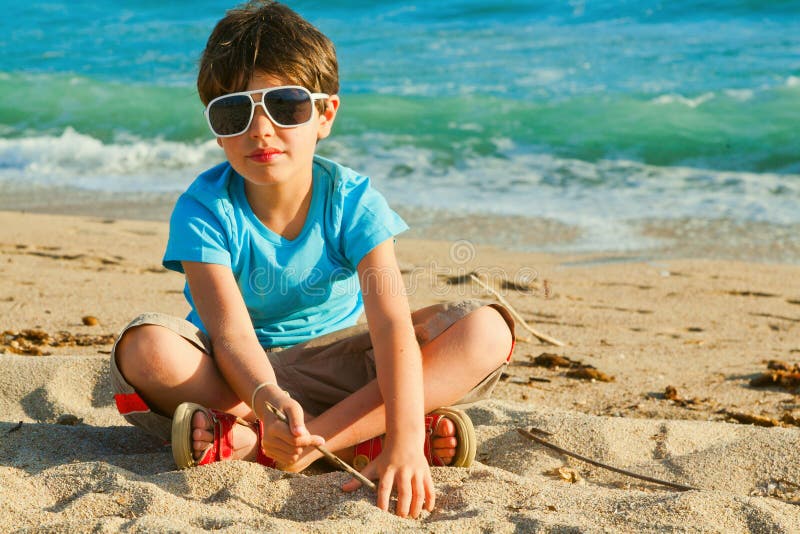 Child playing on the beach stock image. Image of island - 41052249