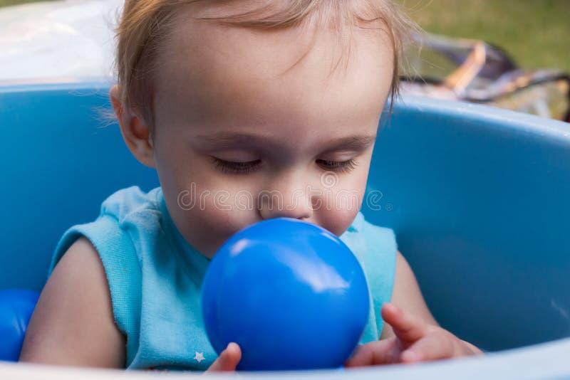 Child Playing with Blue Ball Stock Photo - Image of mouth, play: 92901870