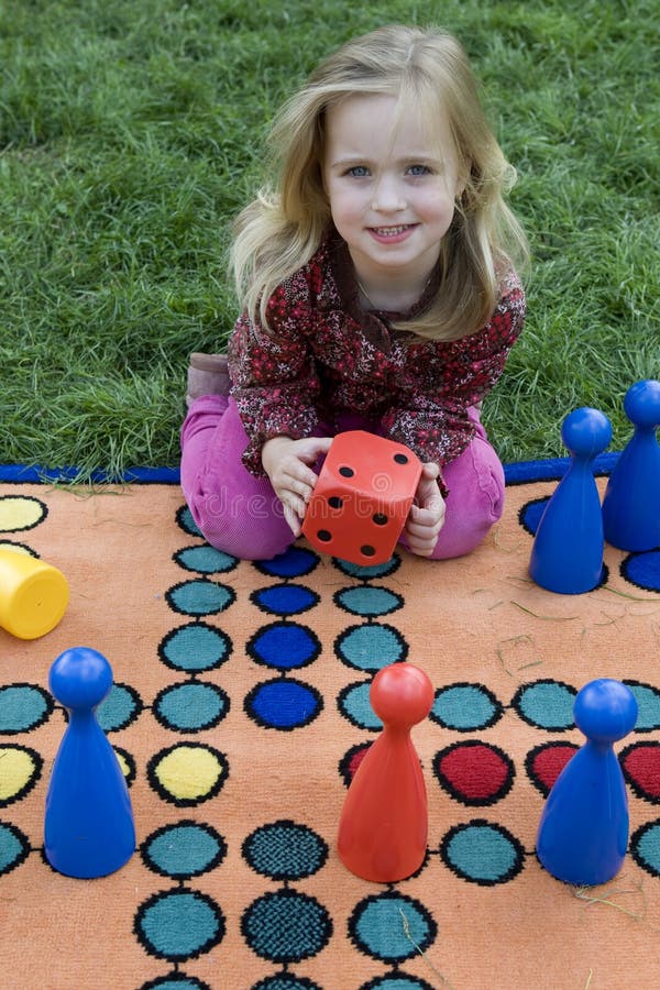 Child playing with a board stock photo. Image of ninepin - 5456356