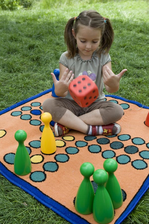 Child playing with a board stock photo. Image of ninepin - 5456356