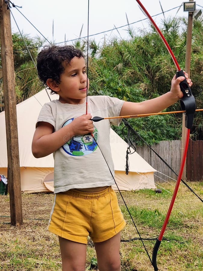 Child Playing with a Bow and Arrow Stock Photo - Image of playground ...