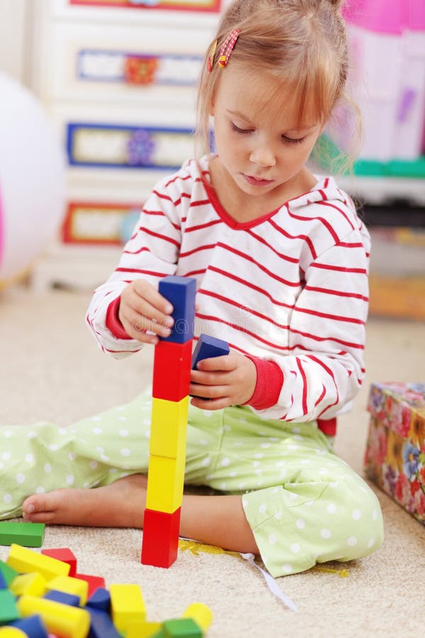 Child playing with bricks stock photo. Image of construction - 16869020