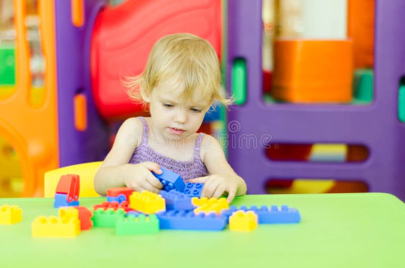Child Playing with Bright Plastic Construction Blocks Stock Photo ...